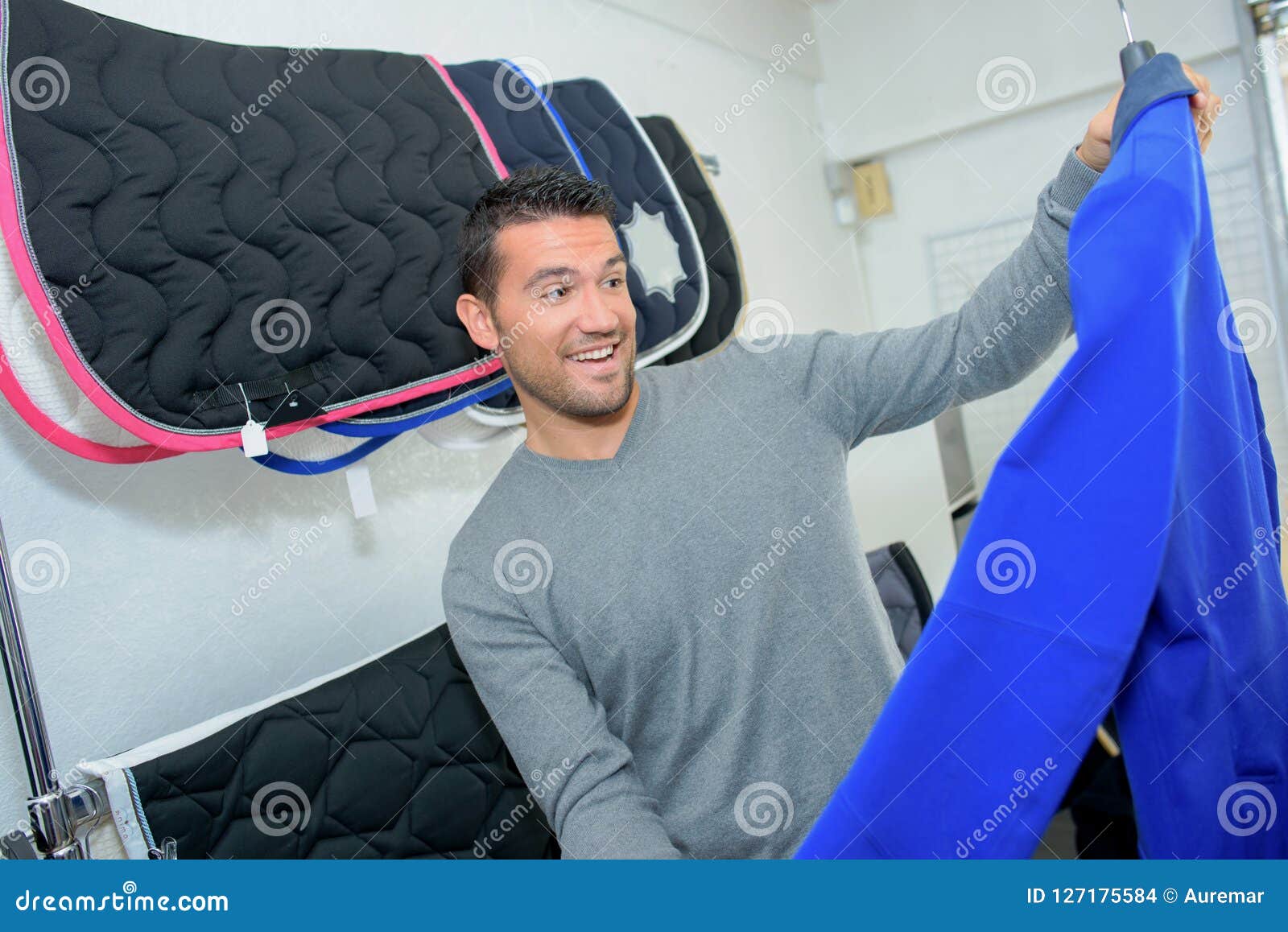 Man in riding store stock photo. Image of equestrian - 127175584