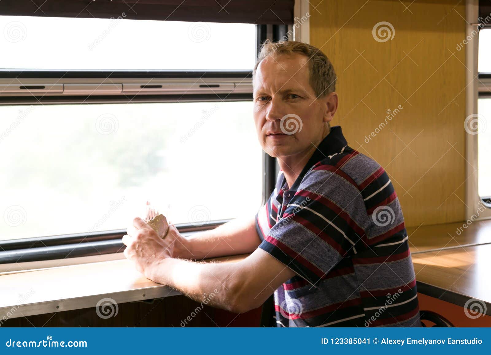 A Man is Riding in a Train Restaurant Car. Stock Image - Image of ...