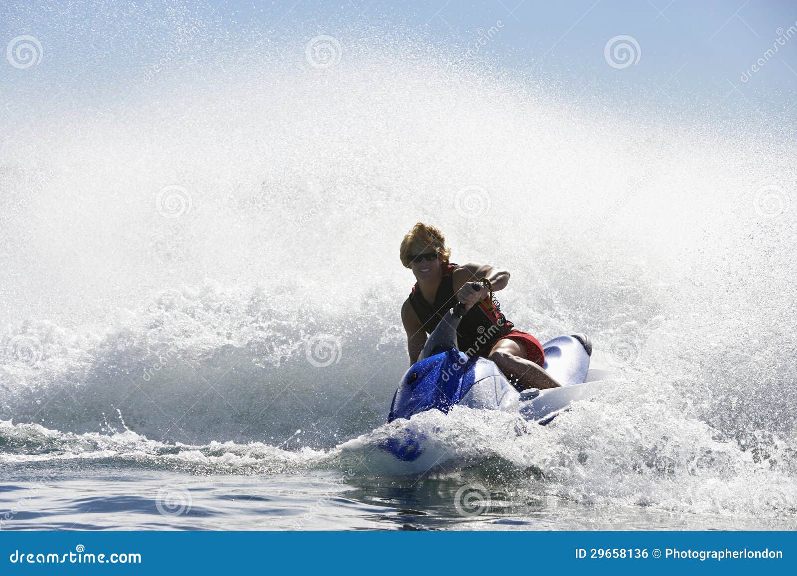 Man Riding Water Scooter stock photo. Image of recreational - 29658136