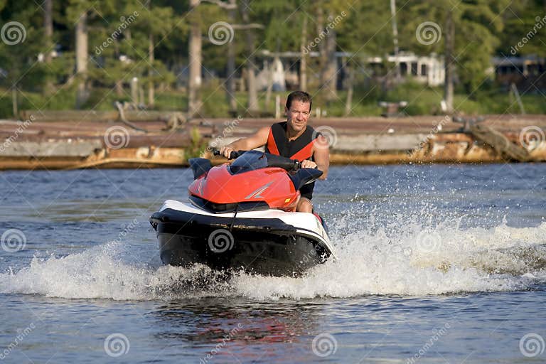 Man riding wave runner stock image. Image of blur, leisure - 6458235