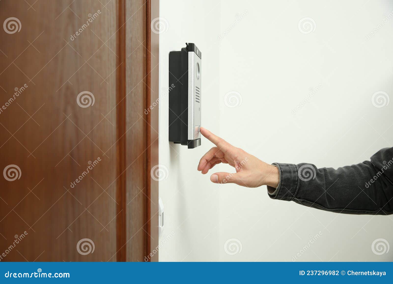 Man Ringing Intercom with Camera in Entryway, Closeup Stock Photo ...