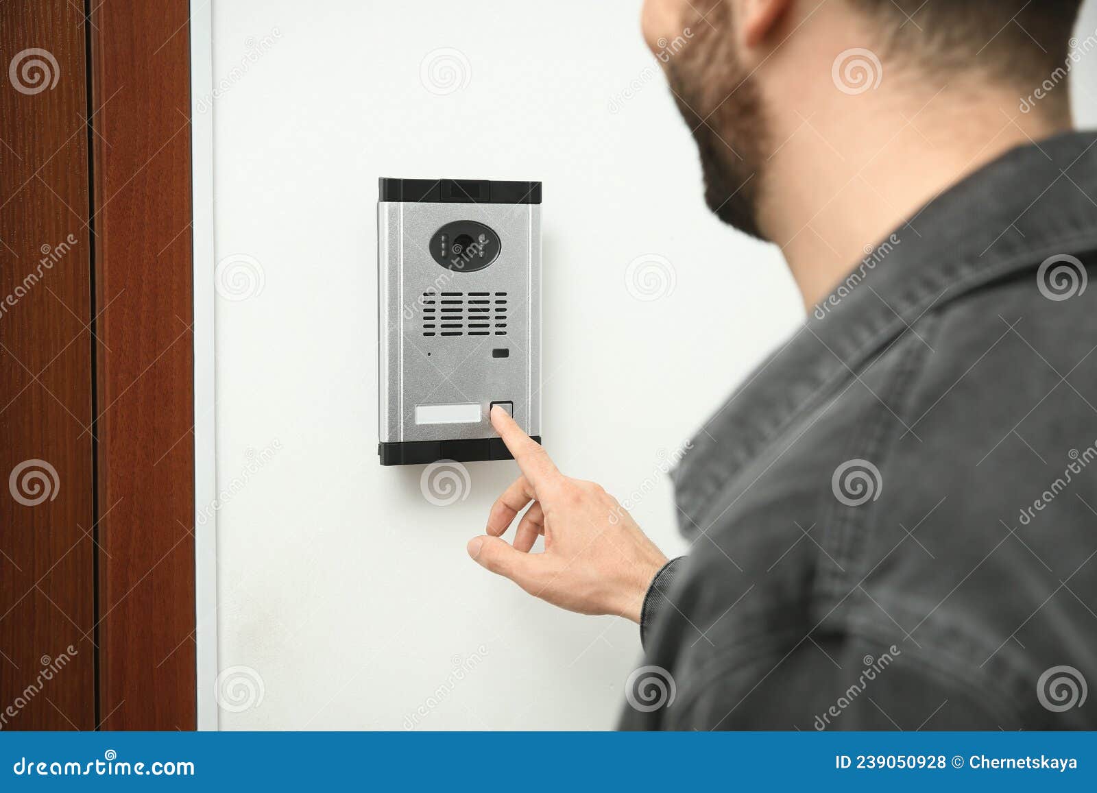 Man Ringing Intercom with Camera in Entryway, Closeup Stock Photo ...