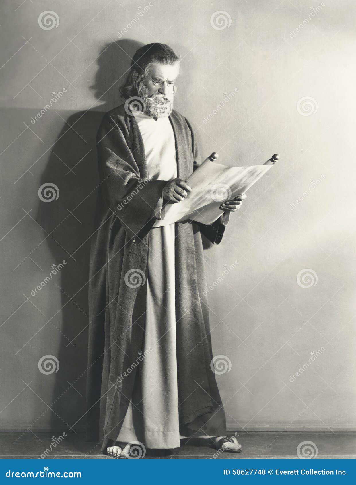 Man in robe reading scroll stock photo. Image of bygone - 58627748