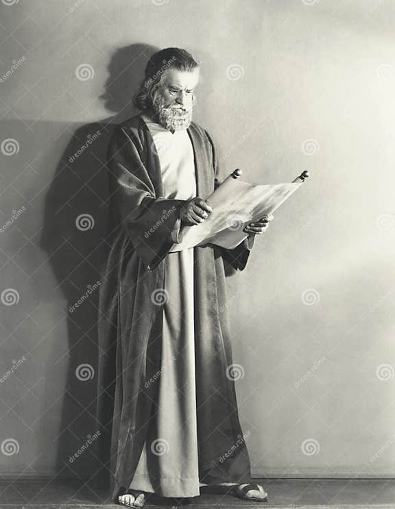Man in robe reading scroll stock photo. Image of bygone - 58627748