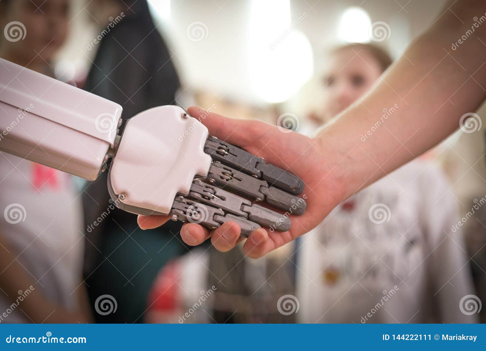 Man and Robot Shaking Hands. Concept of Human Interaction with ...