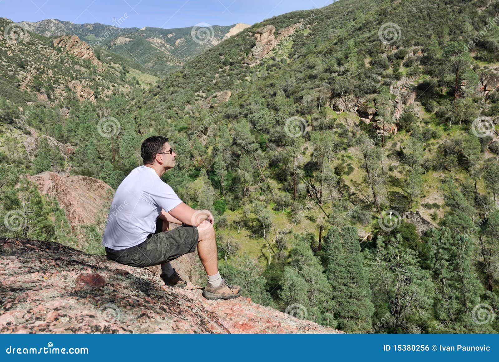 Man on the rock stock photo. Image of green, alone, nature - 15380256