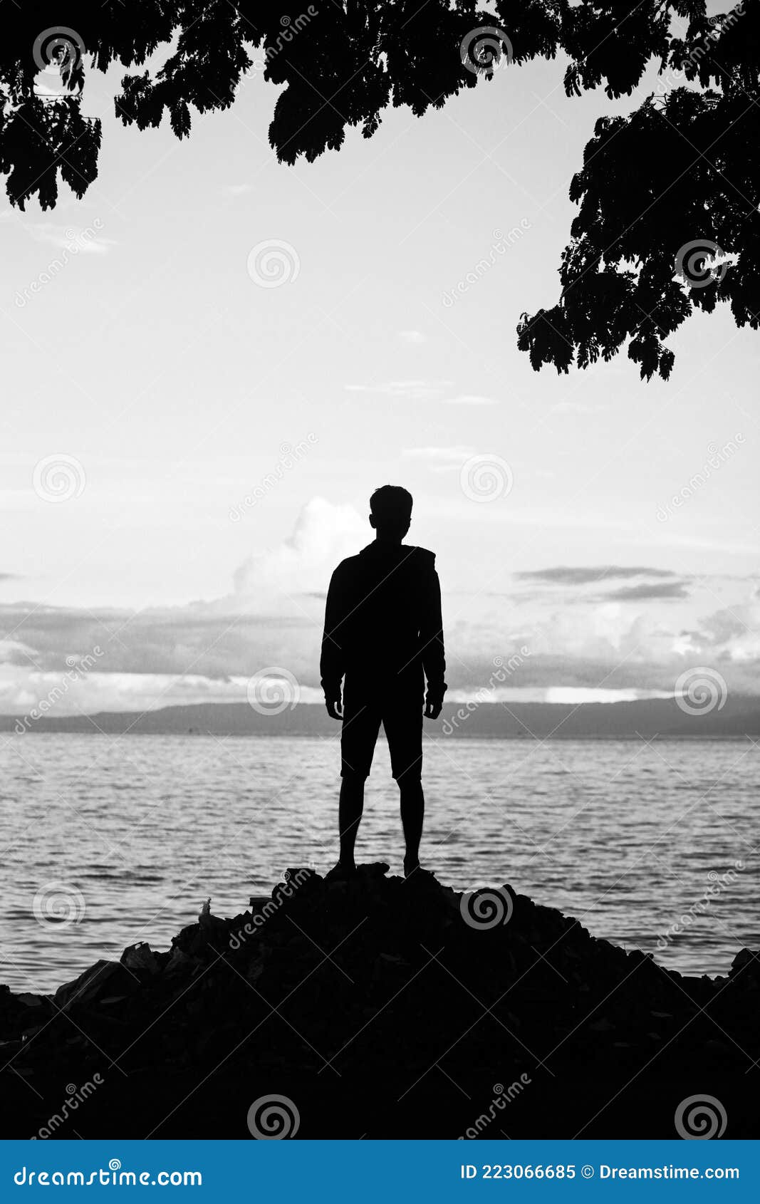 A man on a rock stock image. Image of limit, footwear - 223066685