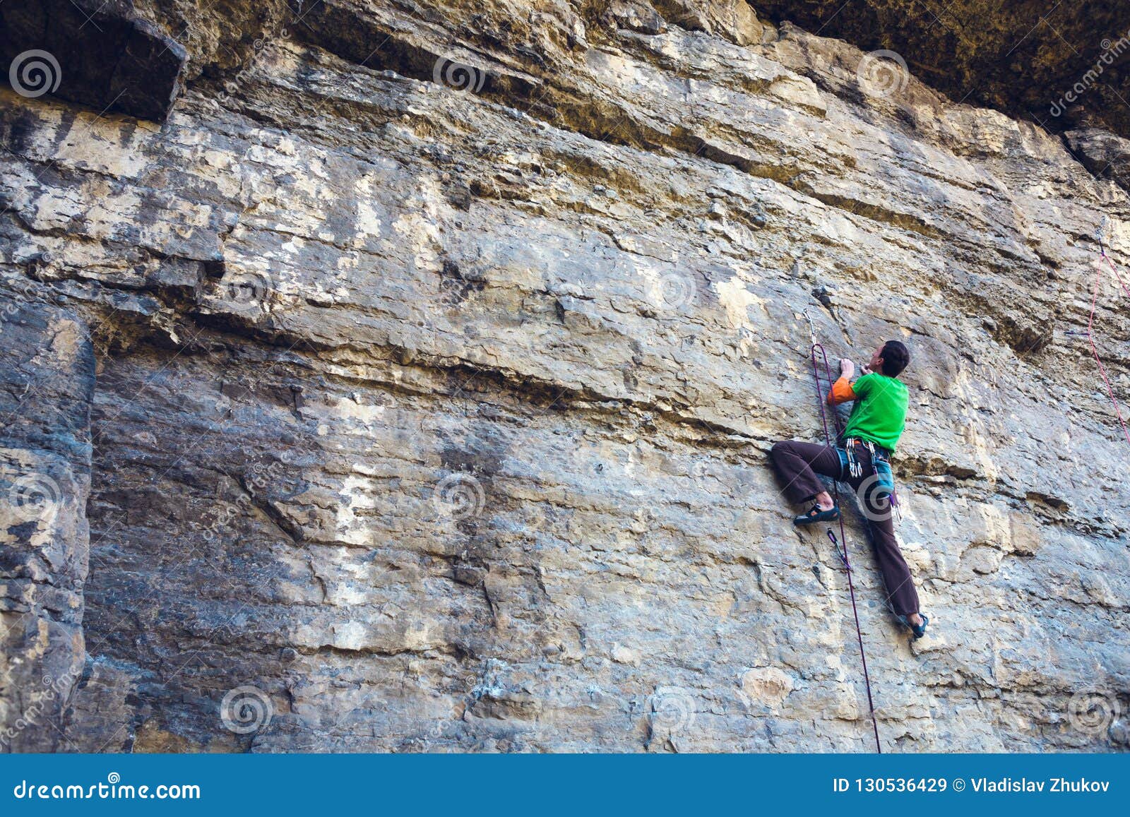 The man on the rock. stock image. Image of courage, outdoor - 130536429