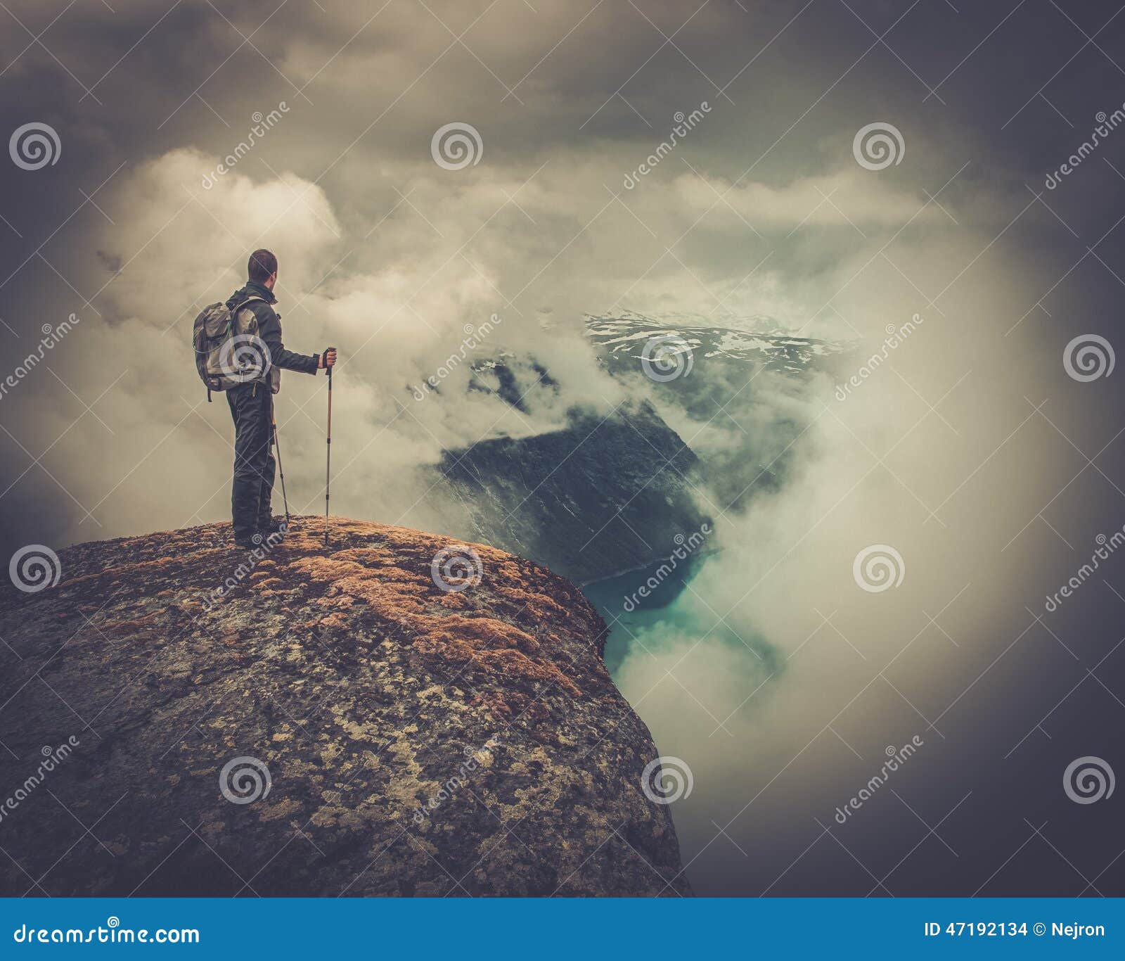 Man on rock s edge stock photo. Image of climber, high - 47192134