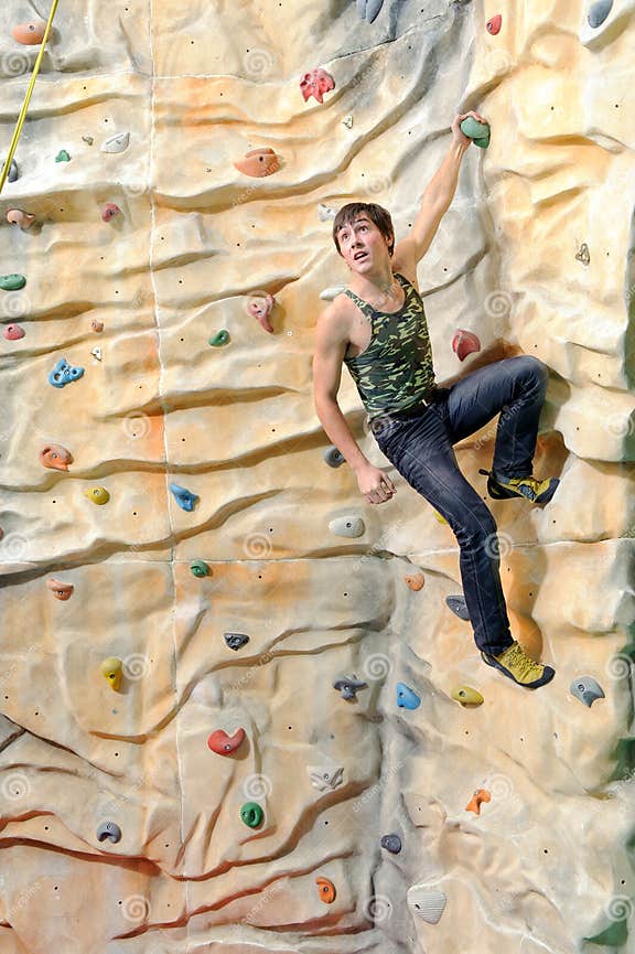 Man on rock wall stock image. Image of male, cliff, rock - 23766277