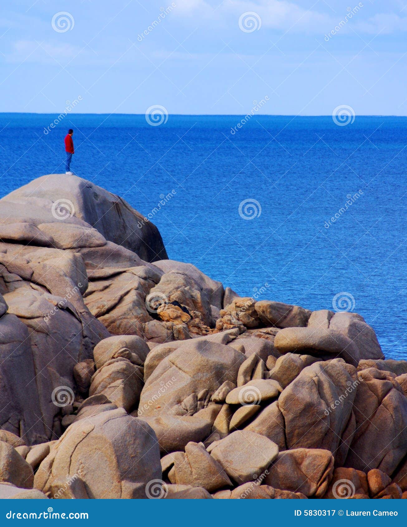 Man on Rocky Cliff Looking Over the Edge Stock Image - Image of search ...