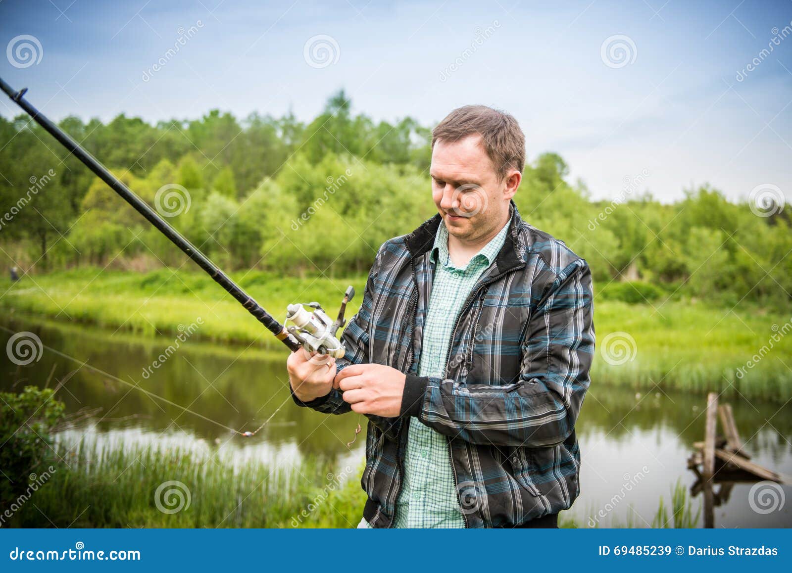 Man with rod stock image. Image of male, tree, sport - 69485239