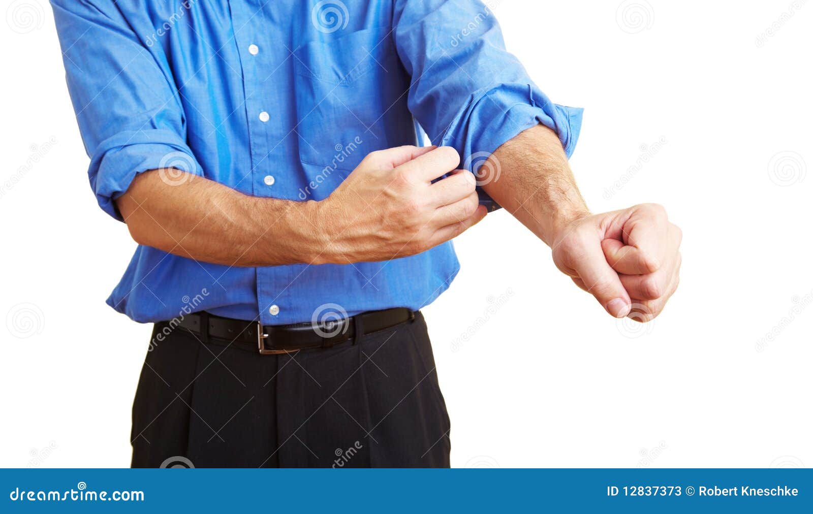 Man rolling up his sleeves stock image. Image of confidence - 12837373