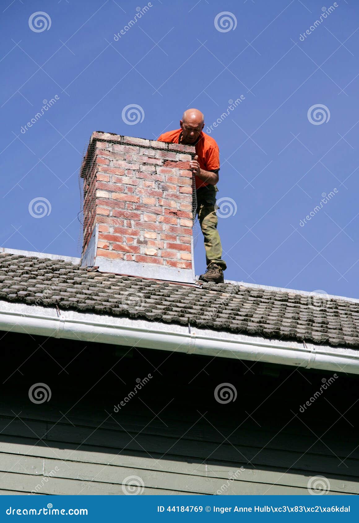 Man on a roof stock image. Image of villa, house, roof - 44184769