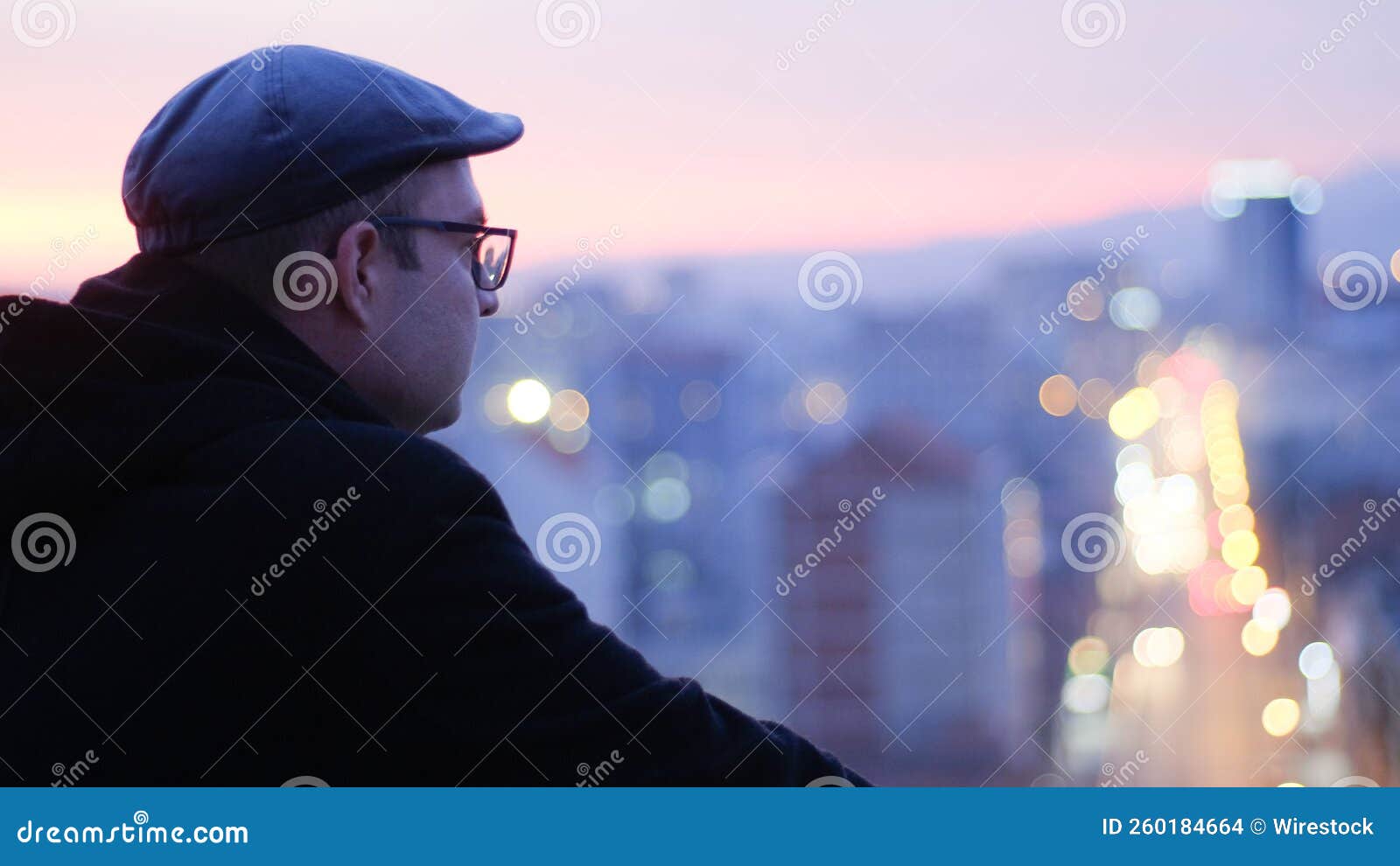 Man on a Rooftop of the Building in the Evening Stock Photo - Image of ...