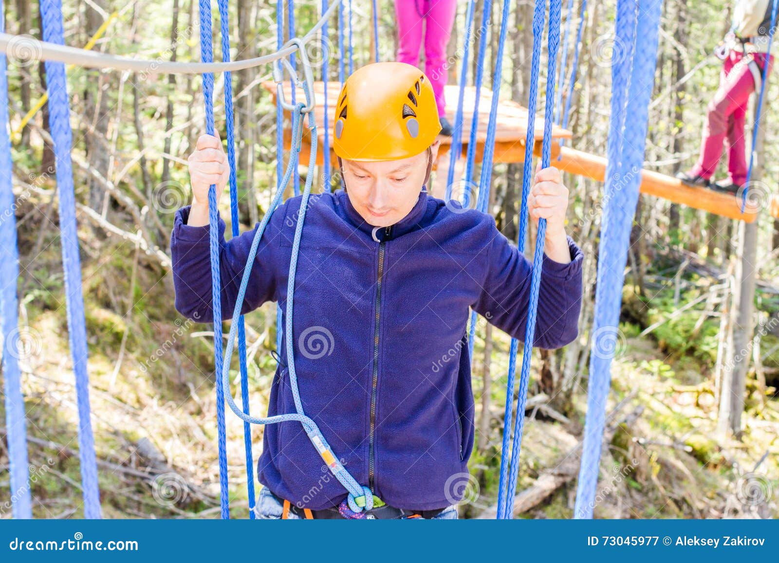 A man in a ropes course stock image. Image of balance - 73045977