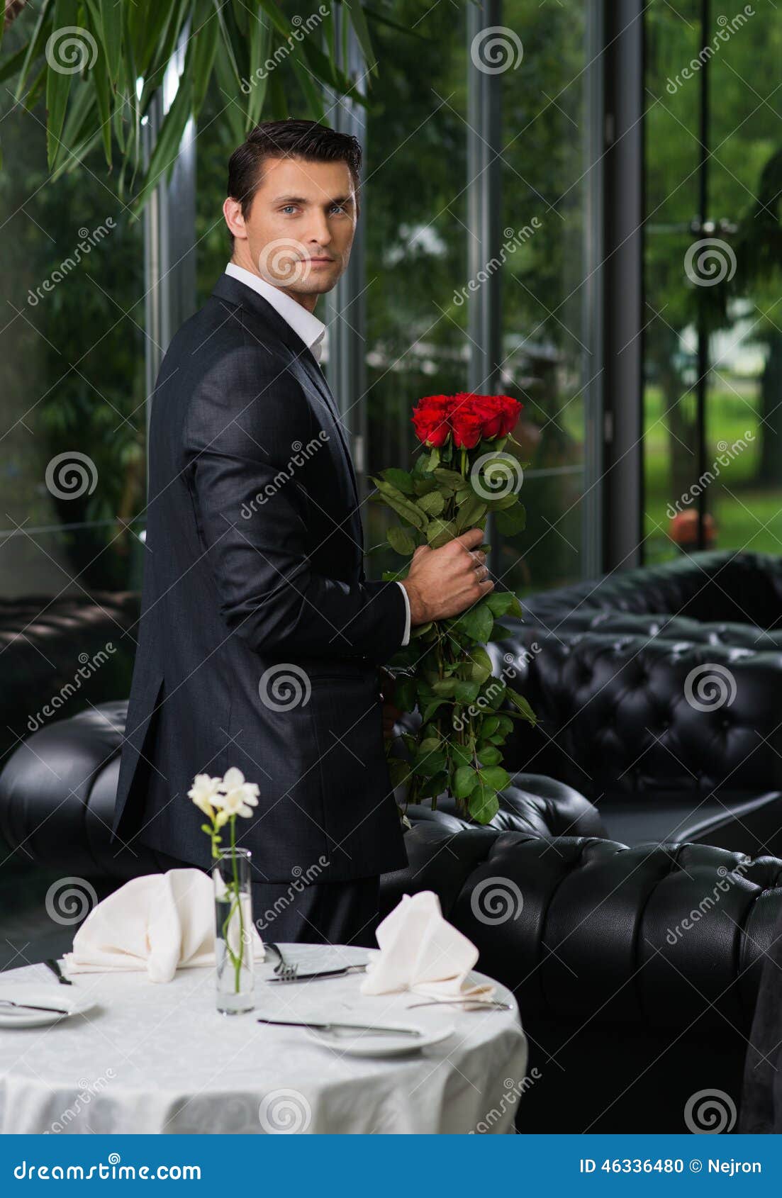 Man with Roses in Restaurant Stock Photo - Image of glamour, valentine ...