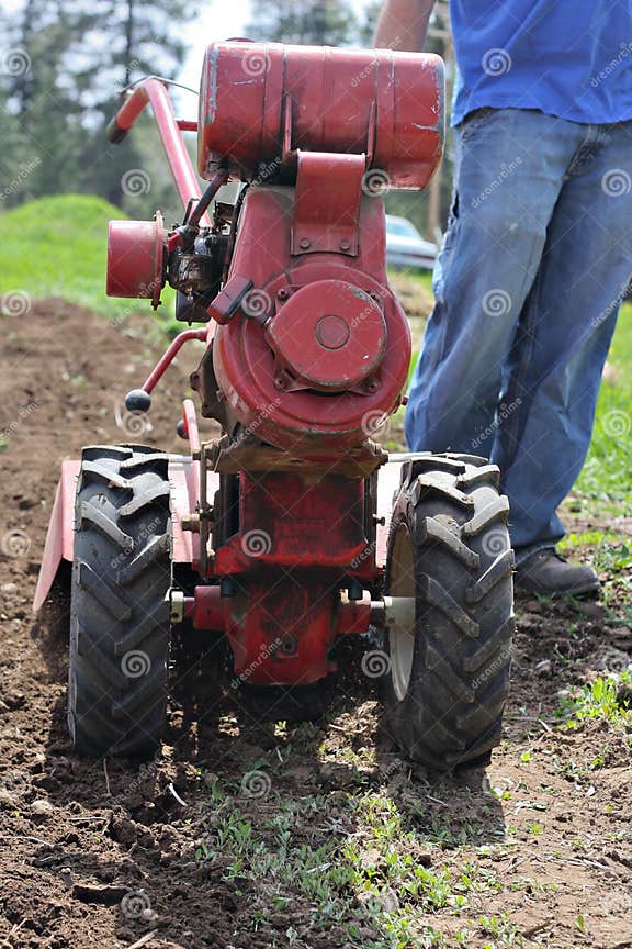 Man rototilling garden. stock photo. Image of cultivating - 10130710