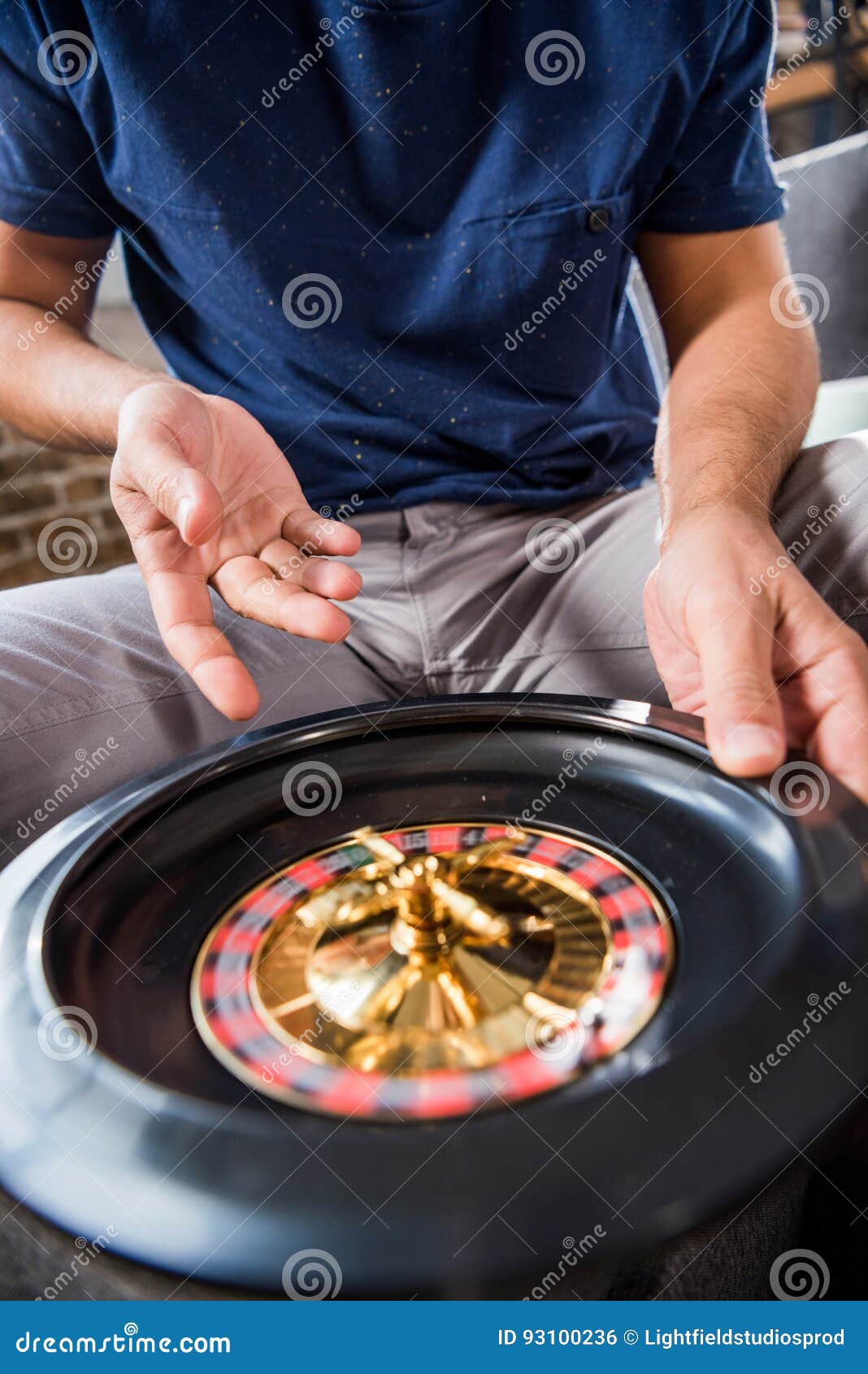 Man with roulette wheel stock photo. Image of wheel, cropped - 93100236
