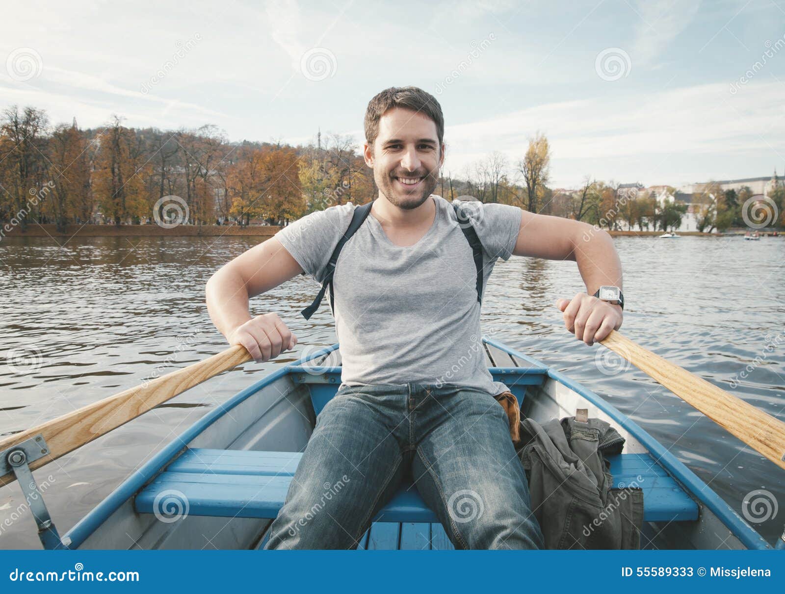 Man rowing on the river stock image. Image of landmark - 55589333