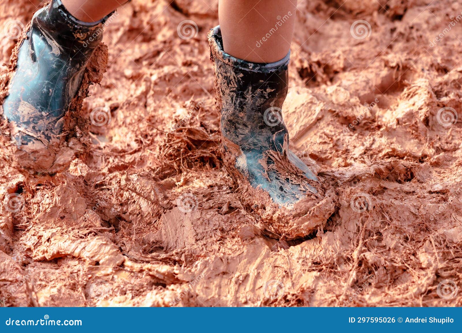 A Man in Rubber Boots Walks on Clay Stock Photo - Image of black ...