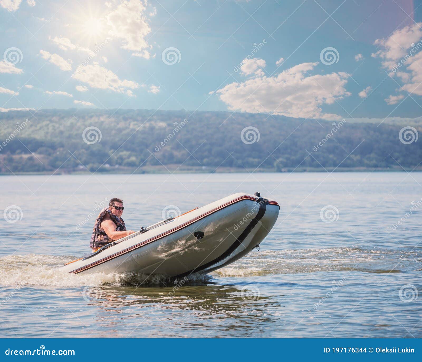 Man in rubber motor boat stock photo. Image of boat - 197176344