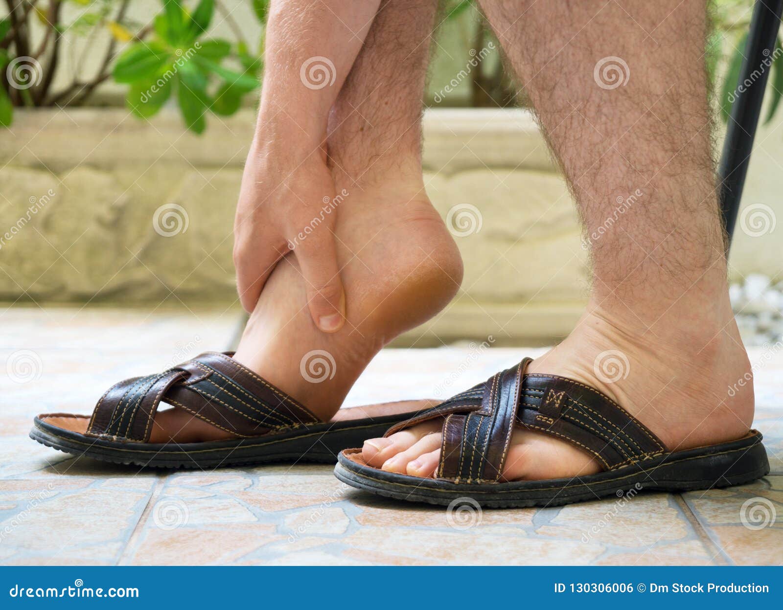 Man rubbing his feet. stock photo. Image of health, legs - 130306006