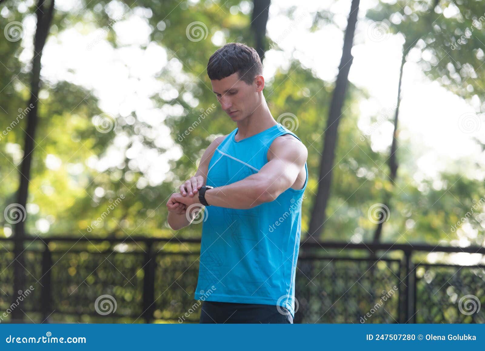Man Runner in Activewear Checking Time on Smartwatch Stock Photo ...