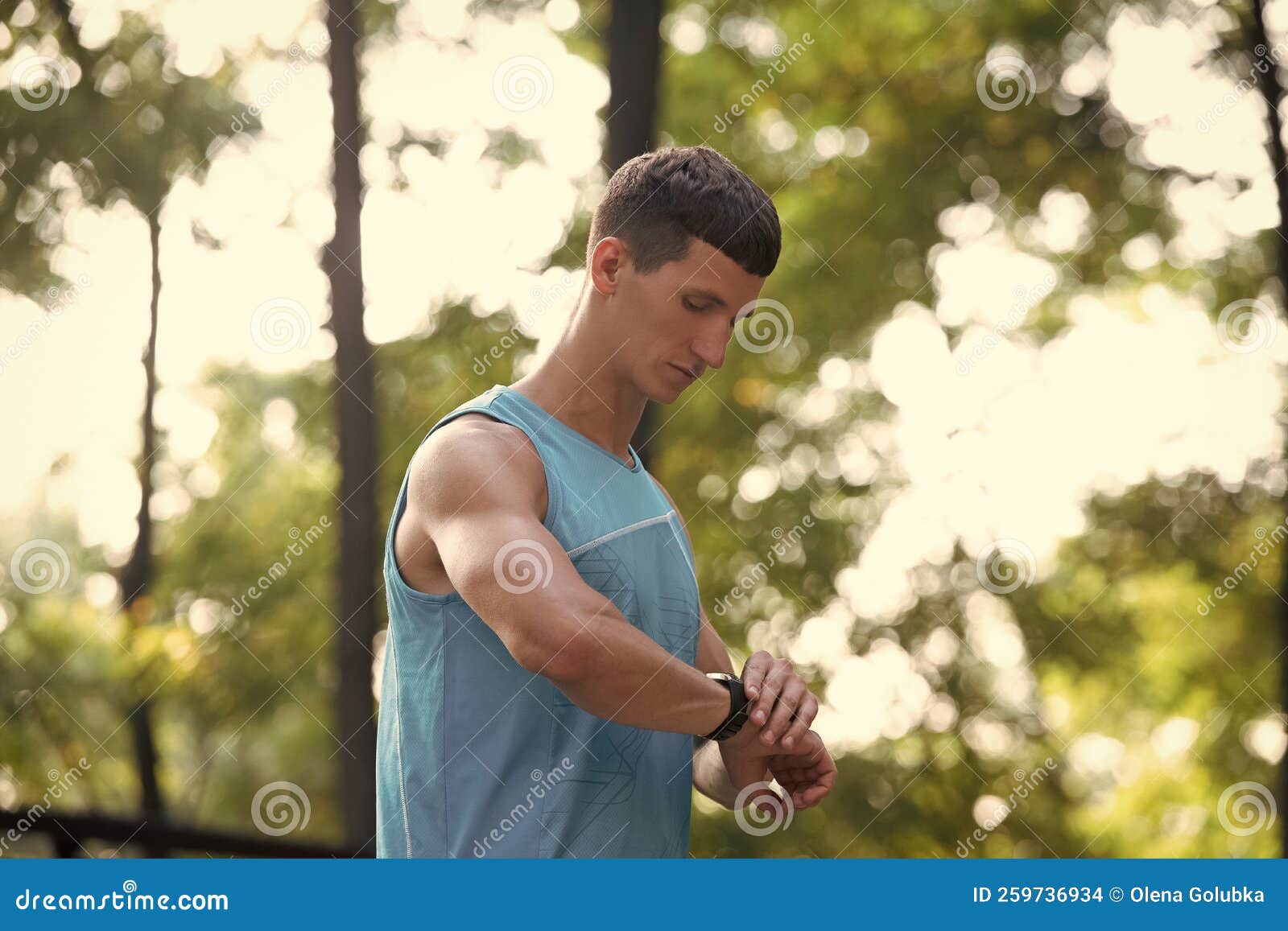 Man Runner in Activewear Checking Time on Tracker Stock Photo - Image ...