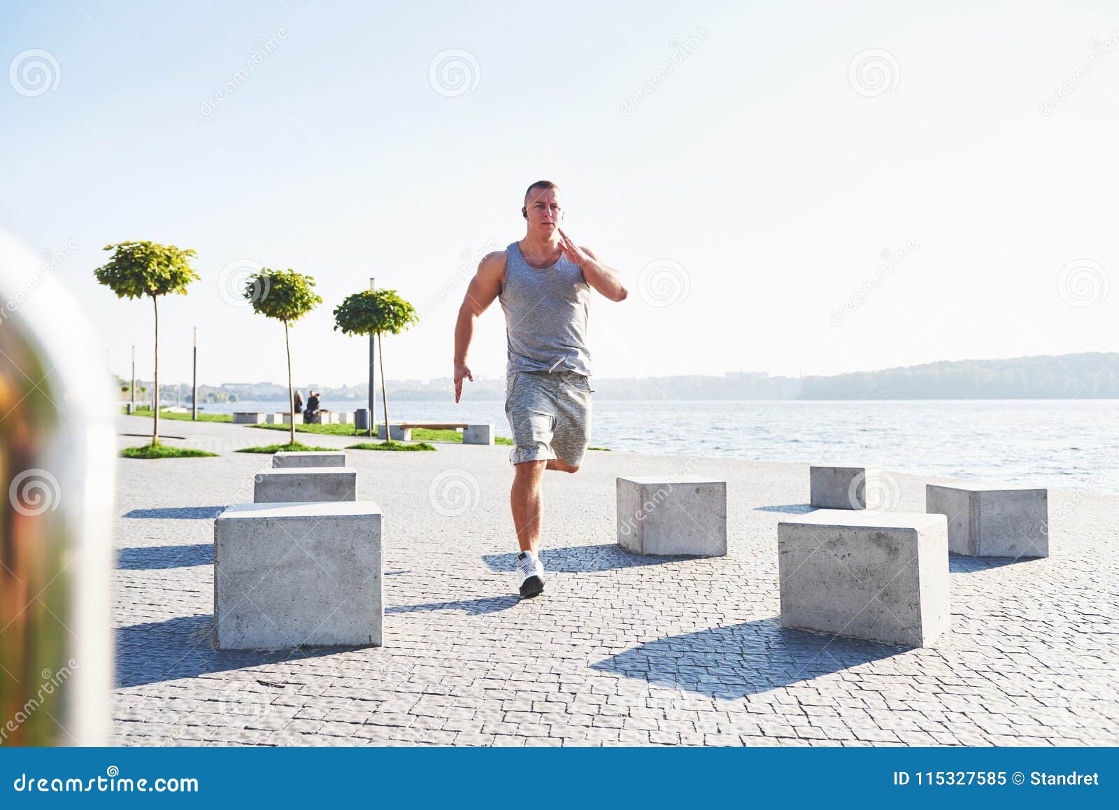 Man Runner Doing Stretching Exercise, Preparing for Morning Workout in ...