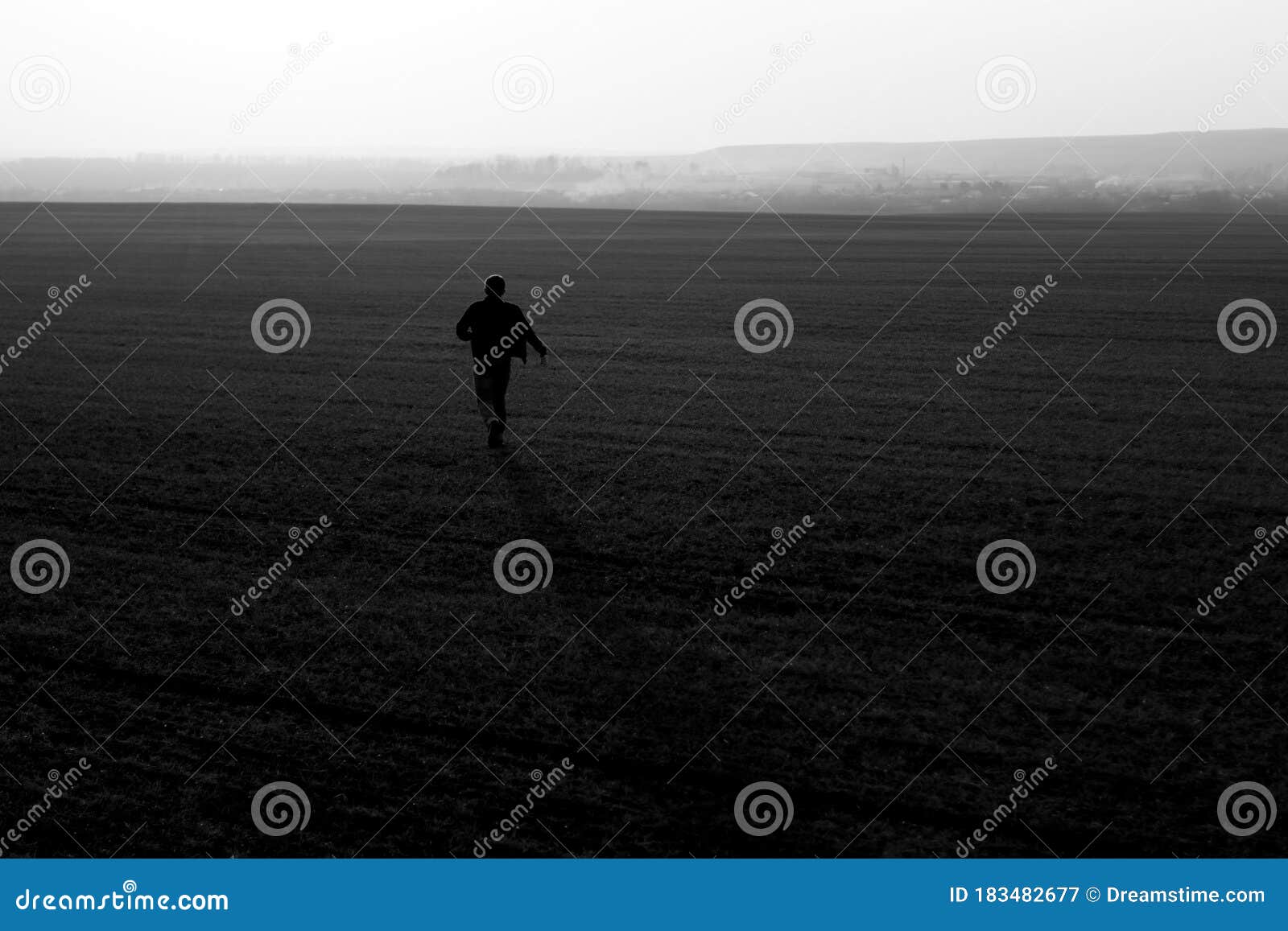A Man Running Across the Field Stock Image - Image of white, person ...