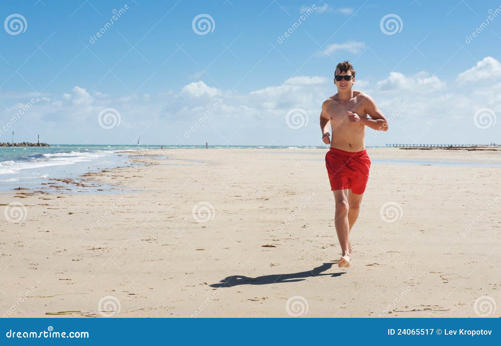 Man Running Along the Coast Stock Image - Image of person, beach: 24065517