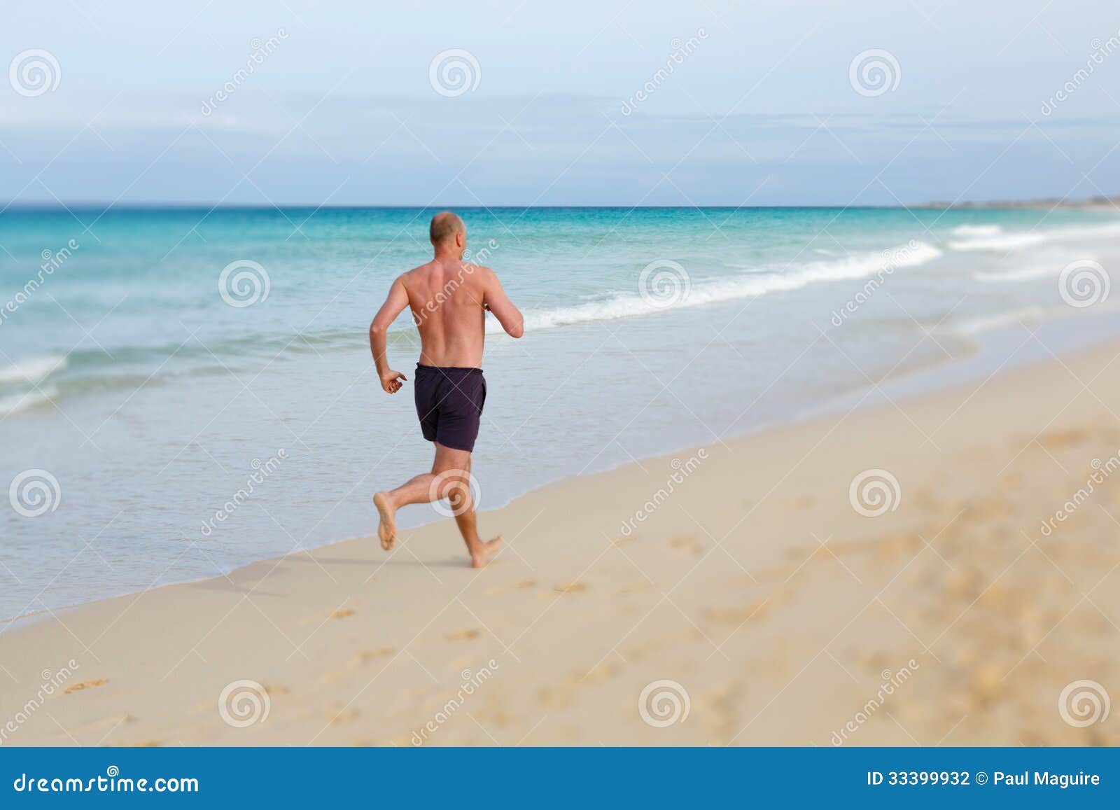Man running on beach stock photo. Image of exercising - 33399932