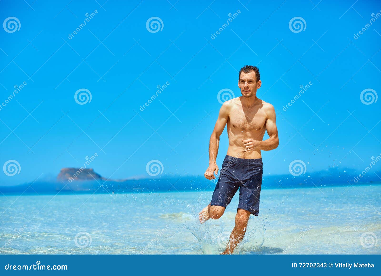 Man running on the beach stock image. Image of cheerfulness - 72702343