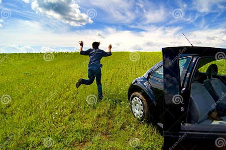 Man Running from Car in Open Field Stock Photo - Image of parked, blue ...