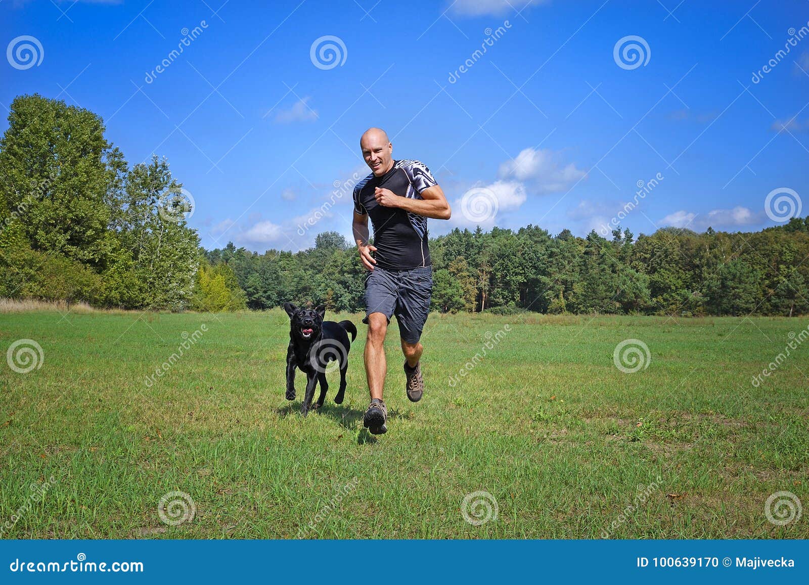 Man running with dog stock photo. Image of nice, healthy - 100639170