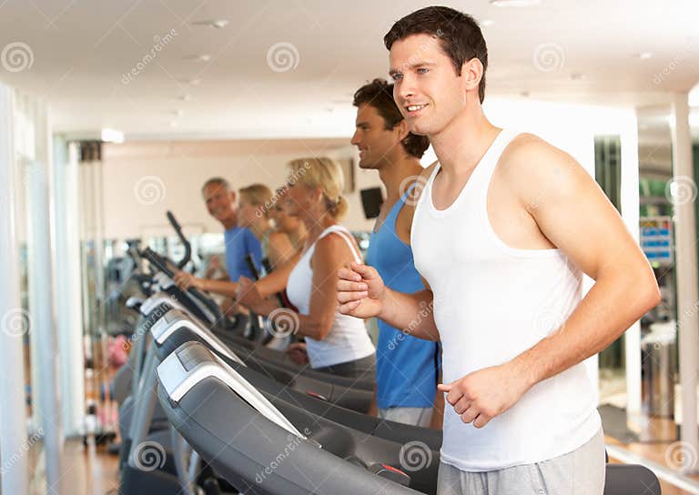 Man on Running Machine stock image. Image of group, treadmill - 16301945