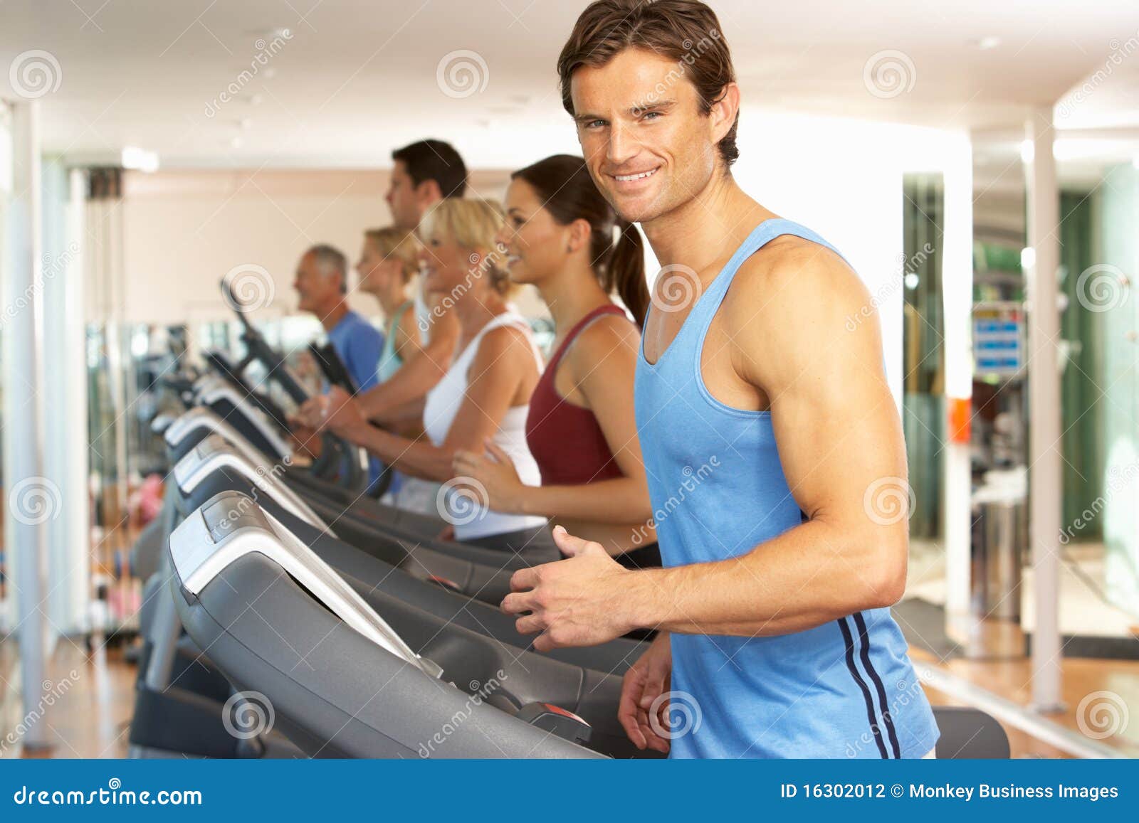 Man on Running Machine stock photo. Image of exercise - 16302012