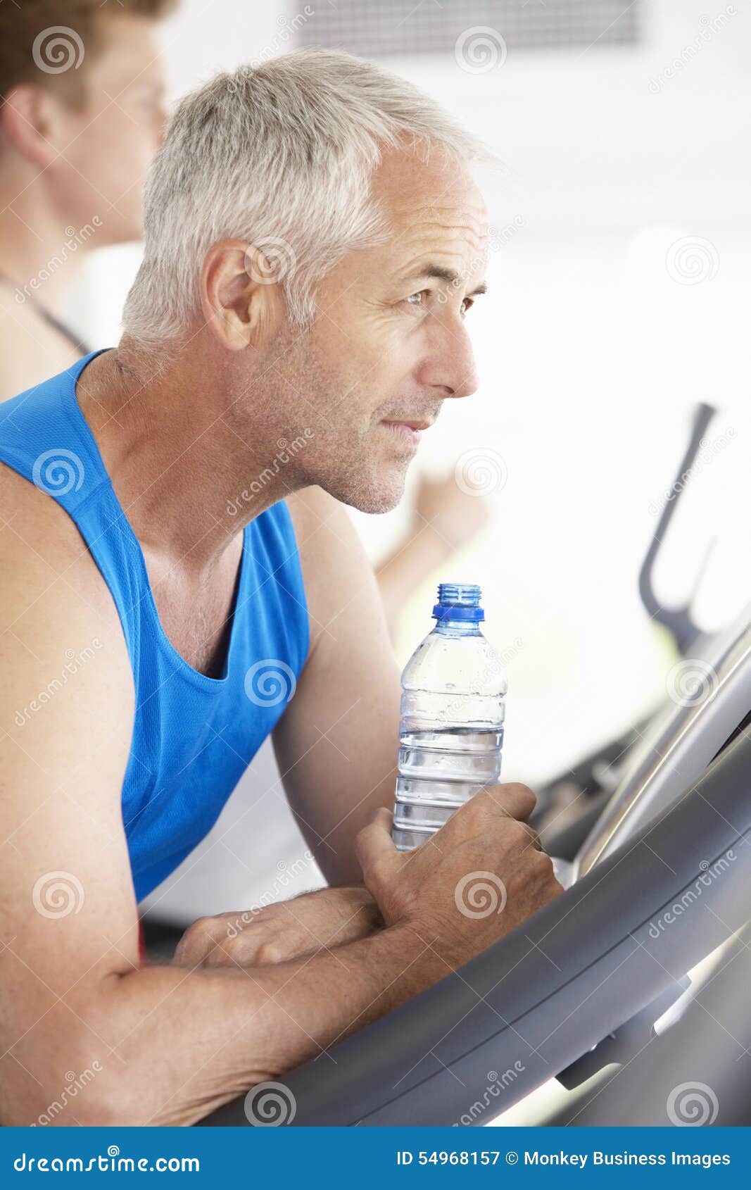 Man on Running Machine in Gym Drinking Water Stock Image - Image of ...
