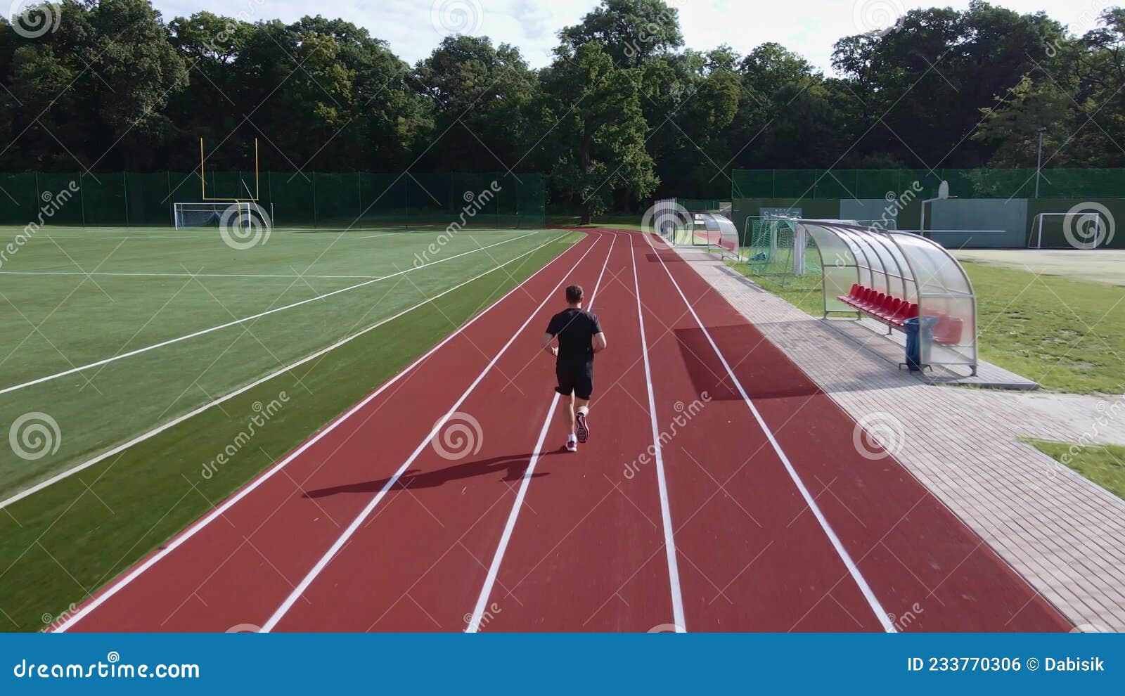 Man Running at Race Track at Stadium Stock Footage - Video of jogging ...