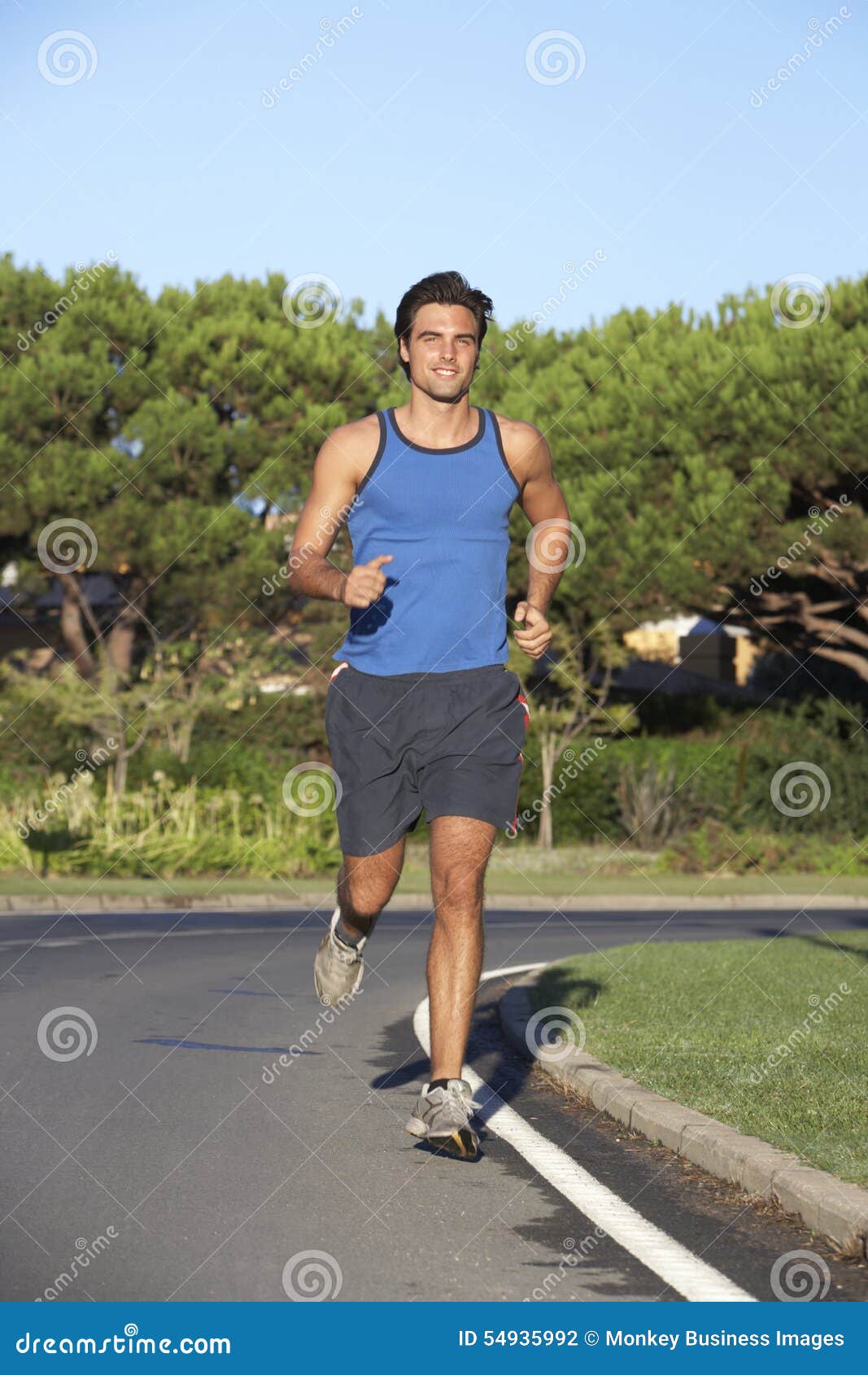 Man Running on Road stock photo. Image of male, park - 54935992