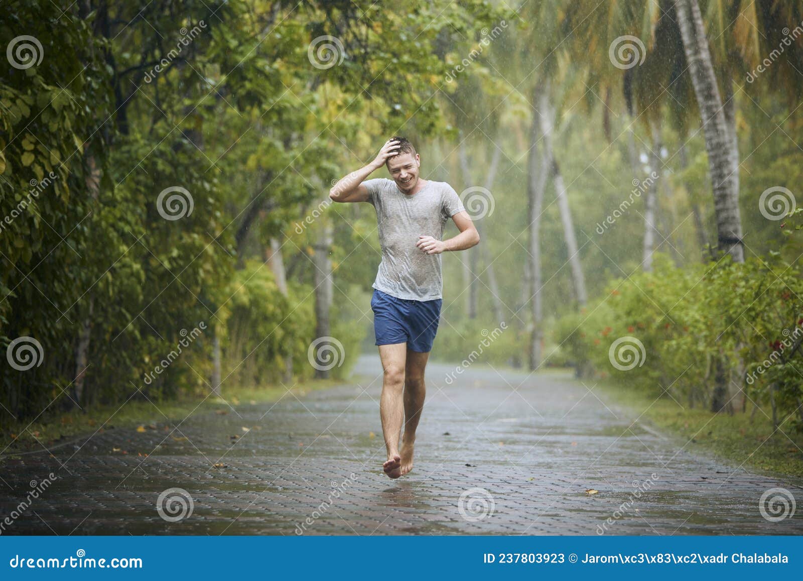 Man Running on Road in Rain Stock Image - Image of drenched, climate ...