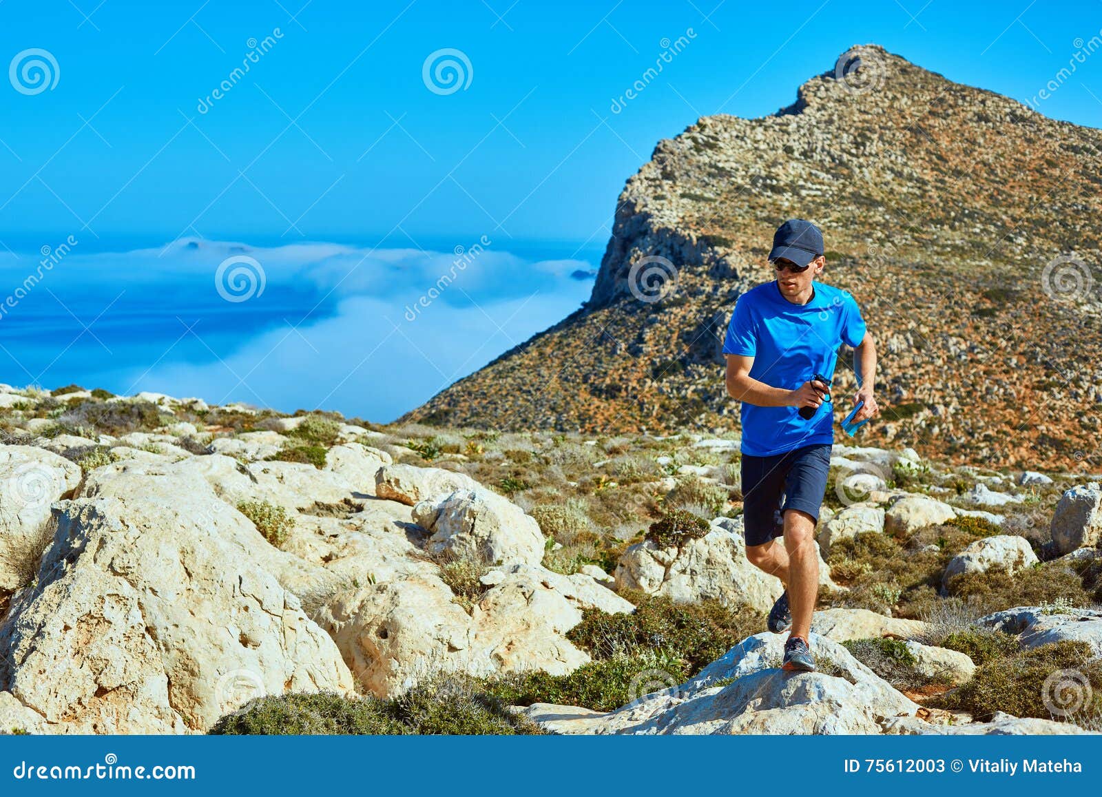 Man running on the rock stock image. Image of blue, difficult - 75612003