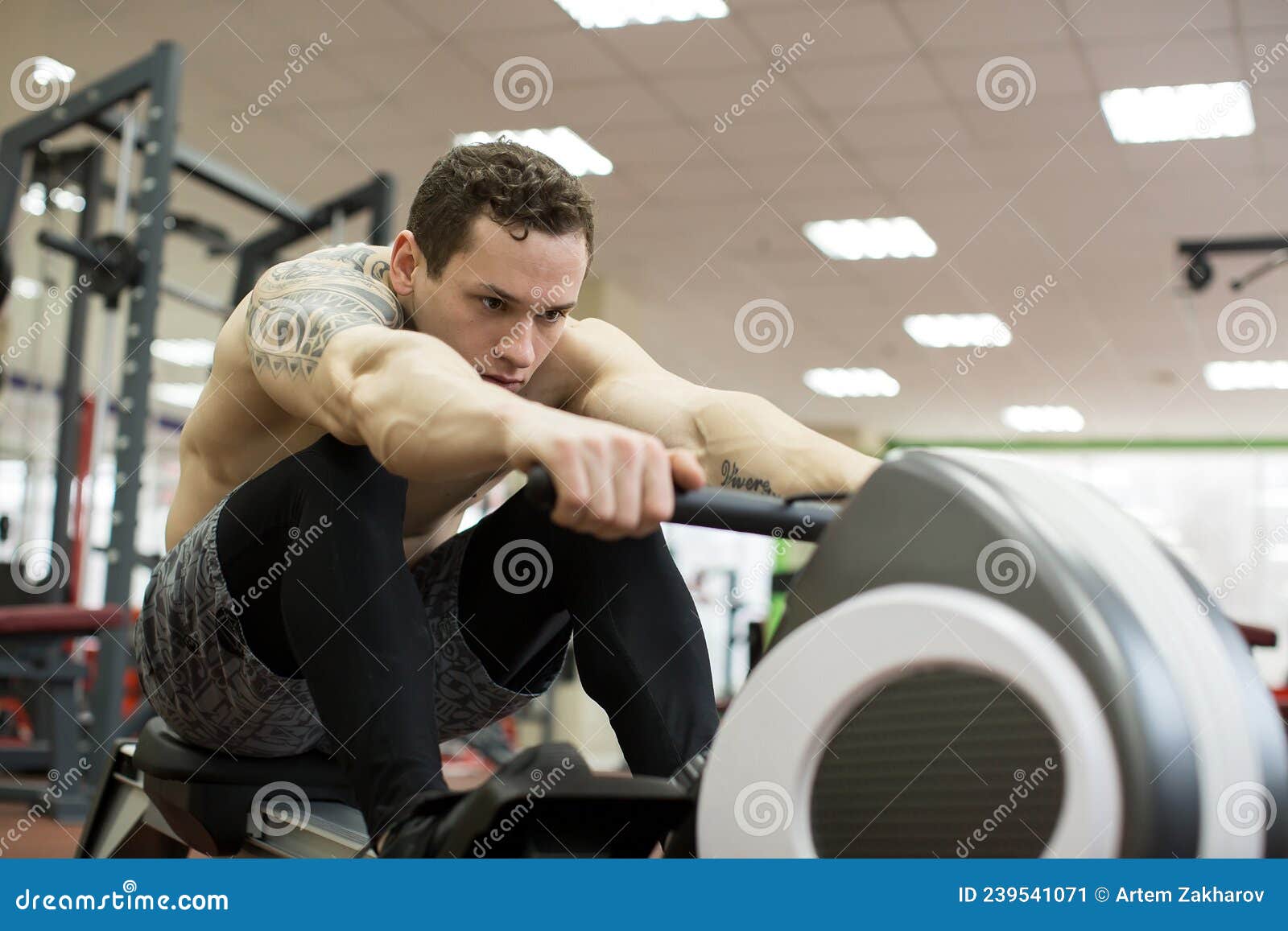 Man Running Rowing Exercise in the Gym. Stock Image - Image of muscular ...