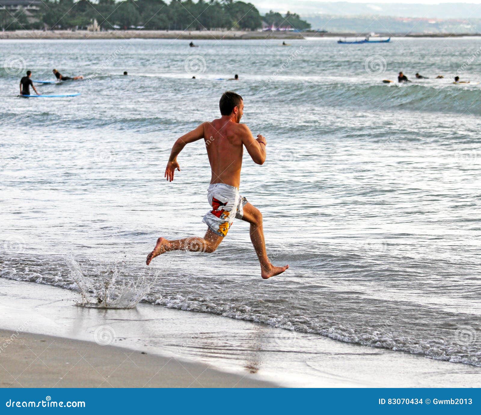 MAN RUNNING into the SEA editorial stock image. Image of holidays ...