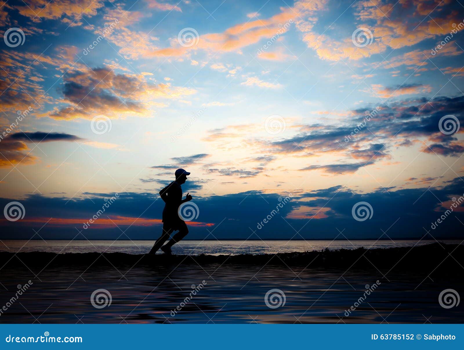 Man running at Sunset stock photo. Image of athletic - 63785152