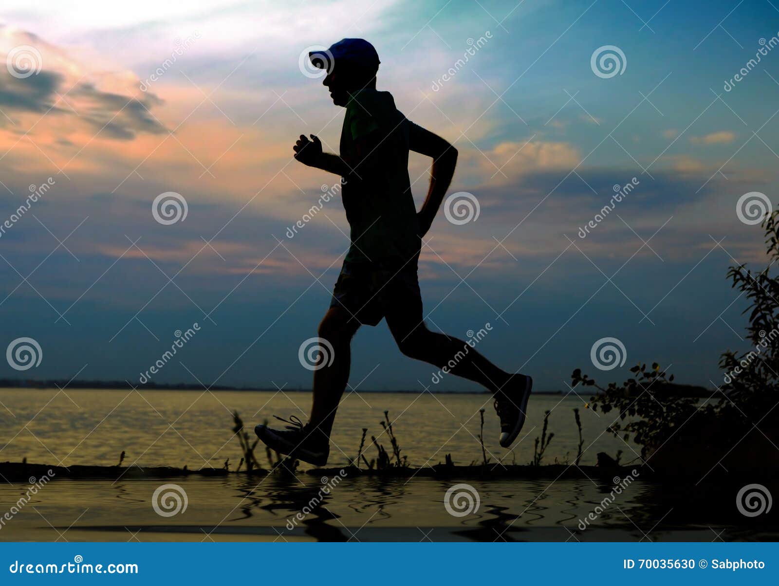 Man running at Sunset stock photo. Image of jogging, athletic - 70035630