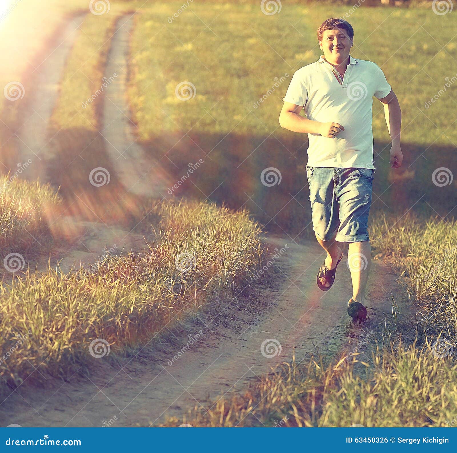 Man Running in Sunset Summer Field Stock Photo - Image of sports ...