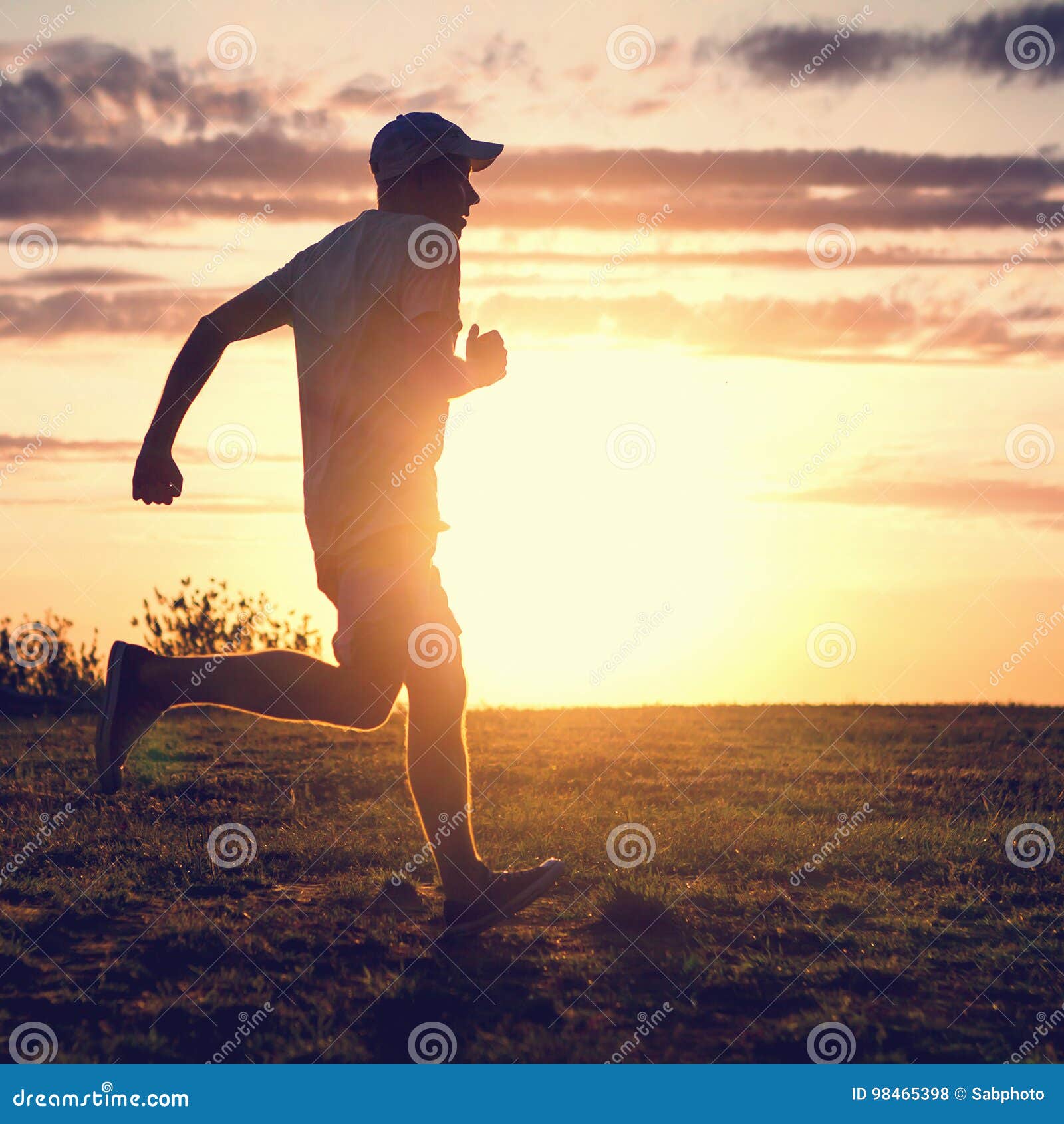 Man running at Sunset stock photo. Image of horizon, happy - 98465398