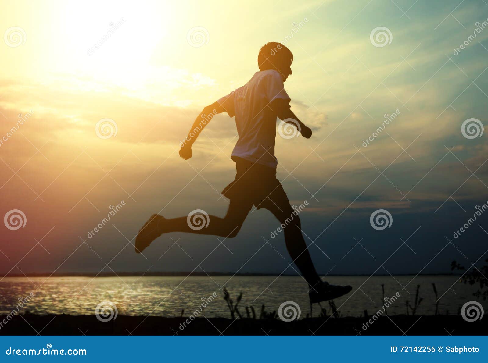 Man running at Sunset stock photo. Image of idyllic, dusk - 72142256